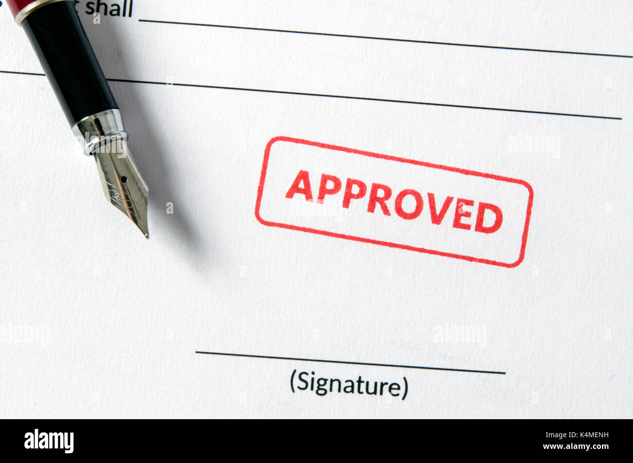 Approved stamp on document. Empty signature field, fountain pen. stamp ...
