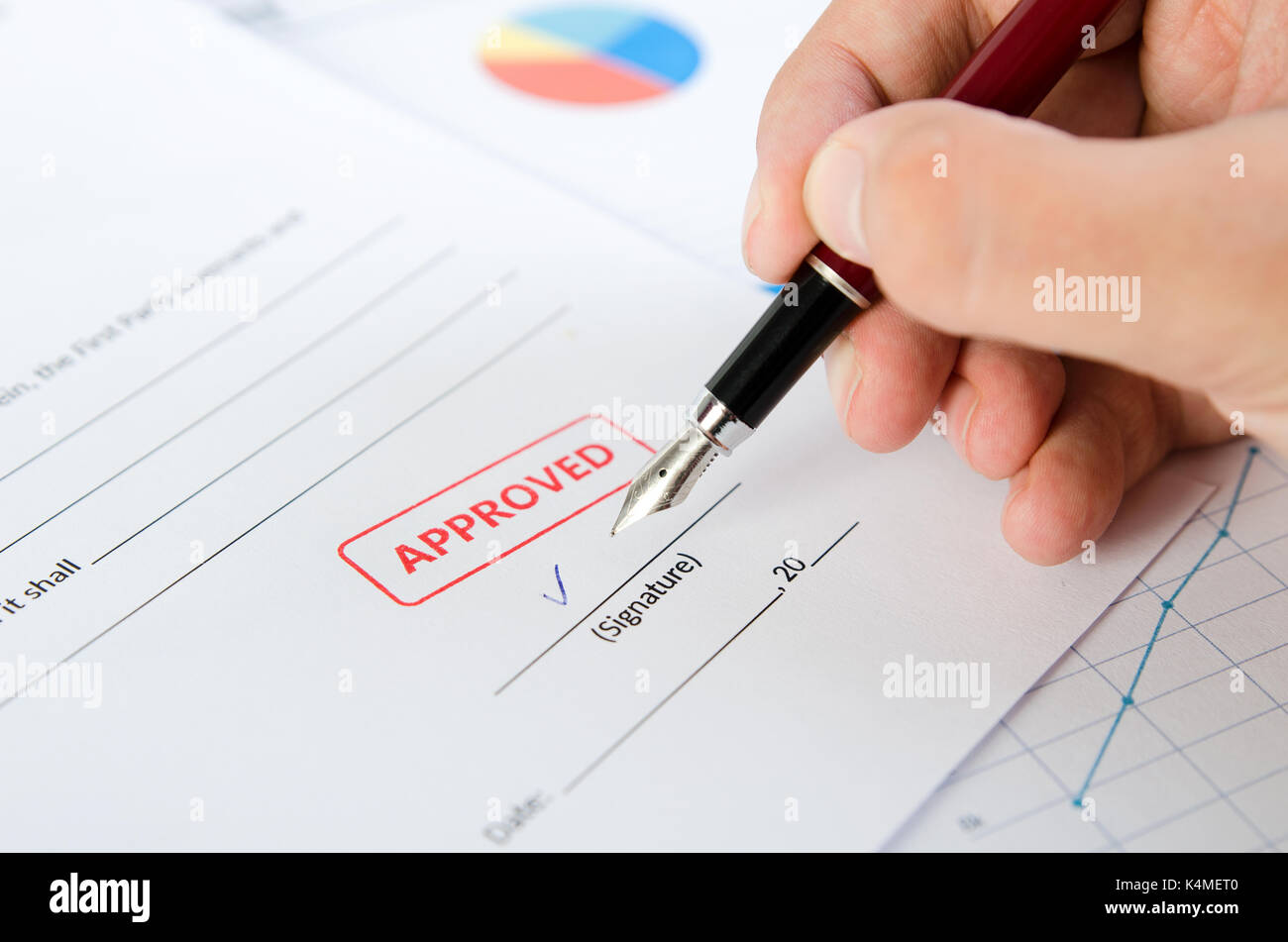 Man signs the contract with pen. Approved stamp on document. stamp ...