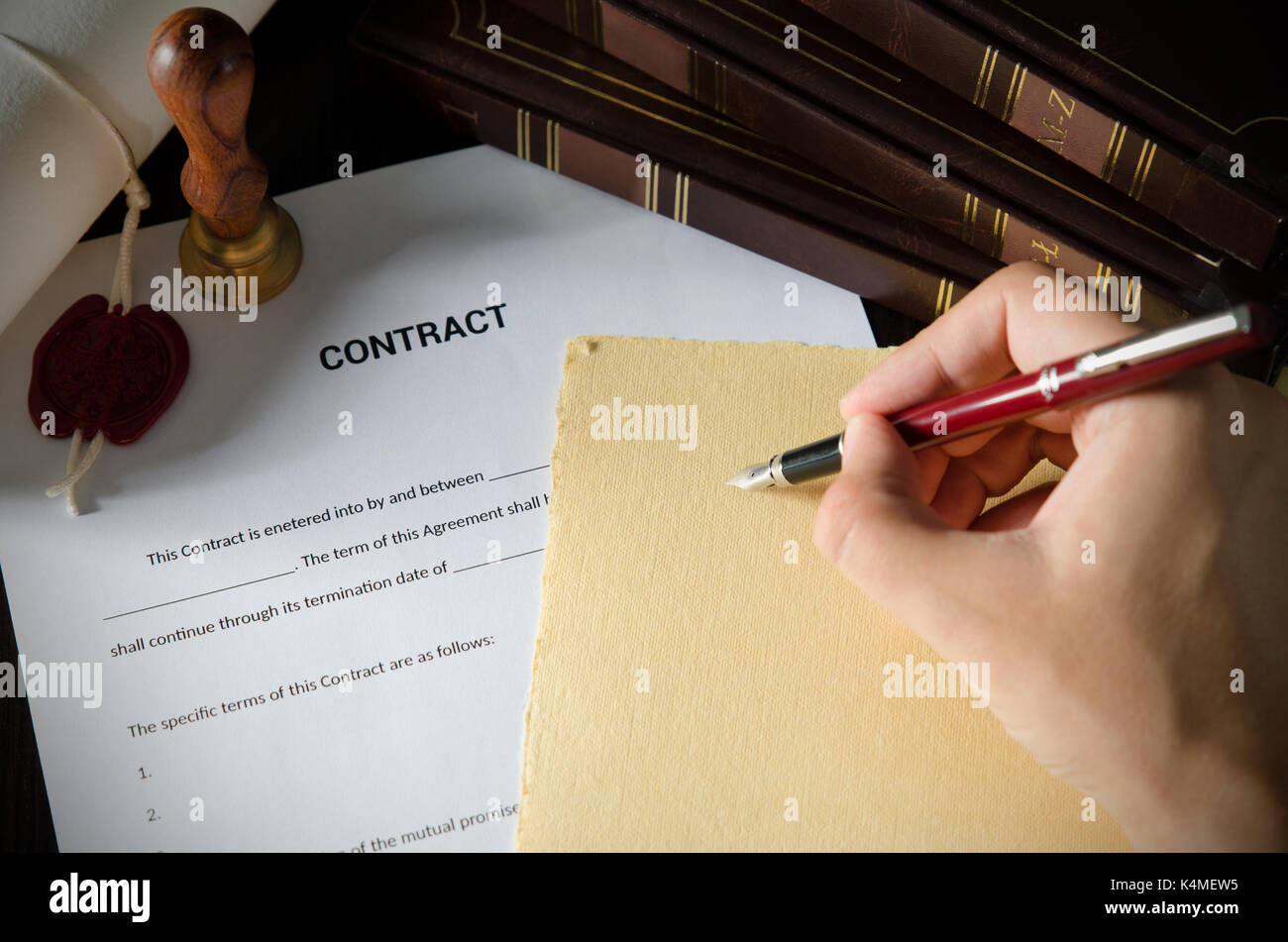 Notary signing a contract with fountain pen. business man law attorney ...