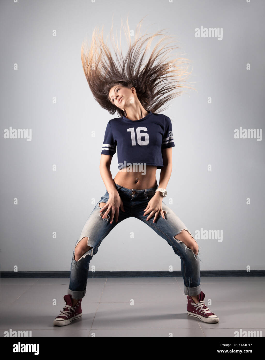 modern young beautiful dancer posing on a studio background Stock Photo ...