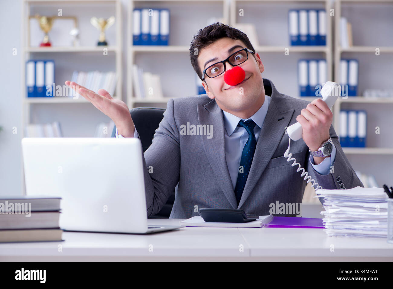 Clown businessman working in the office Stock Photo - Alamy