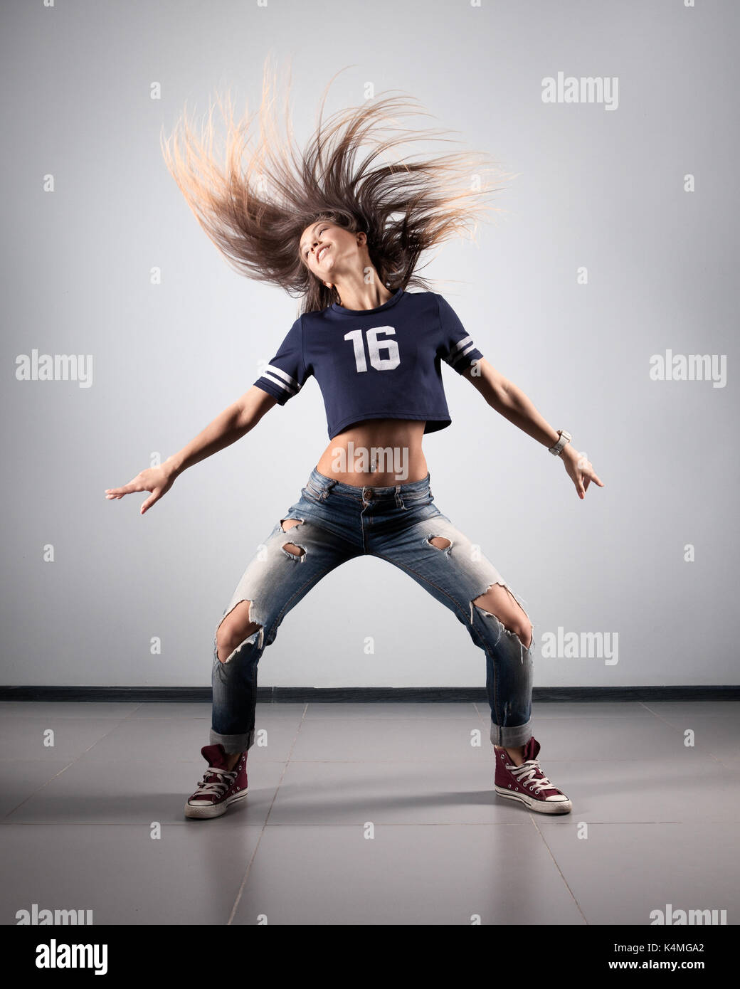 modern young beautiful dancer posing on a studio background Stock Photo ...