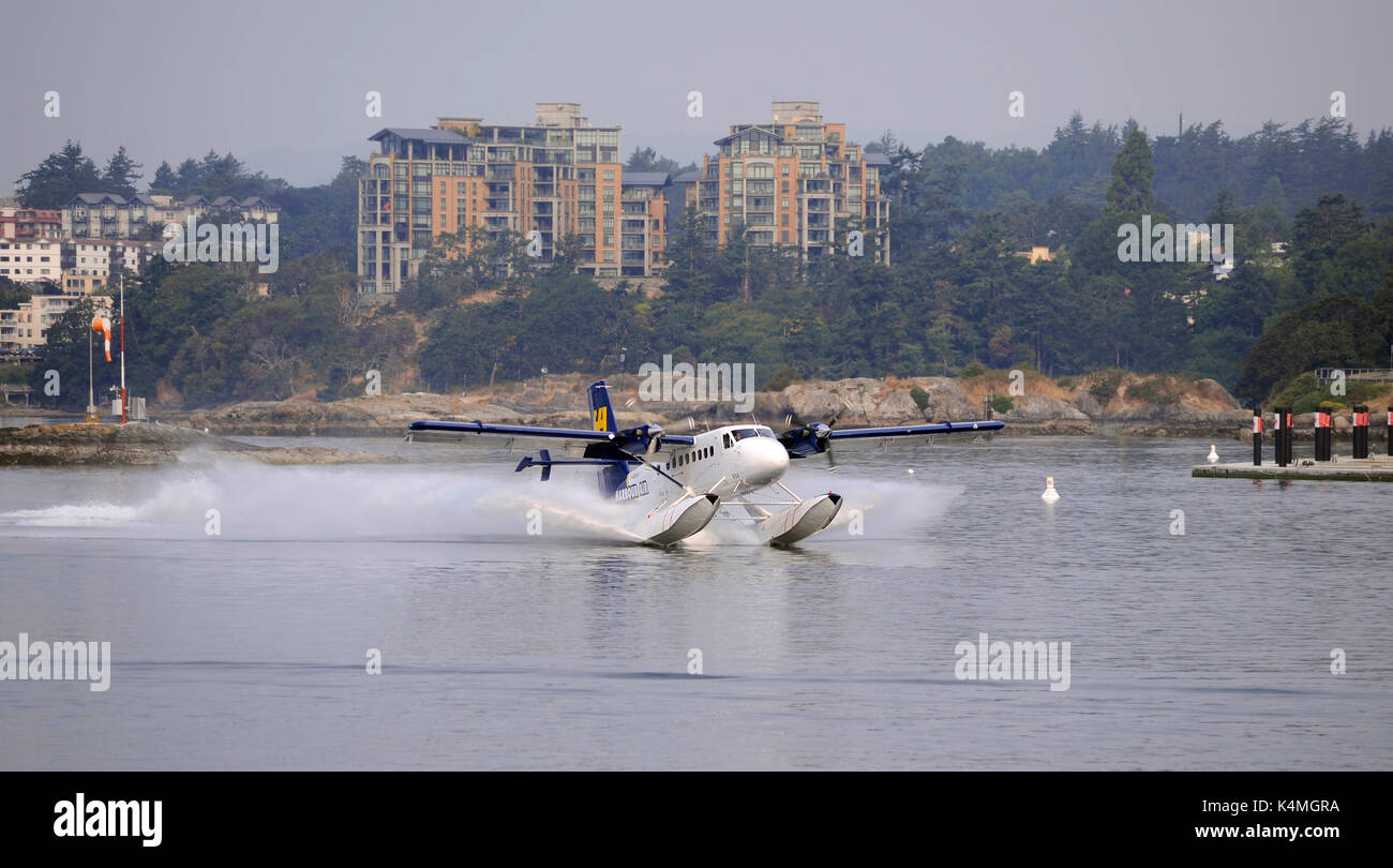 deHavilland DHC-6 Twin Otter float plane lands on the water. Inner ...