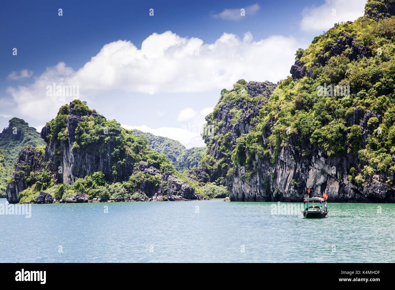 cruising among beautiful limestone rocks and secluded beaches in Ha ...