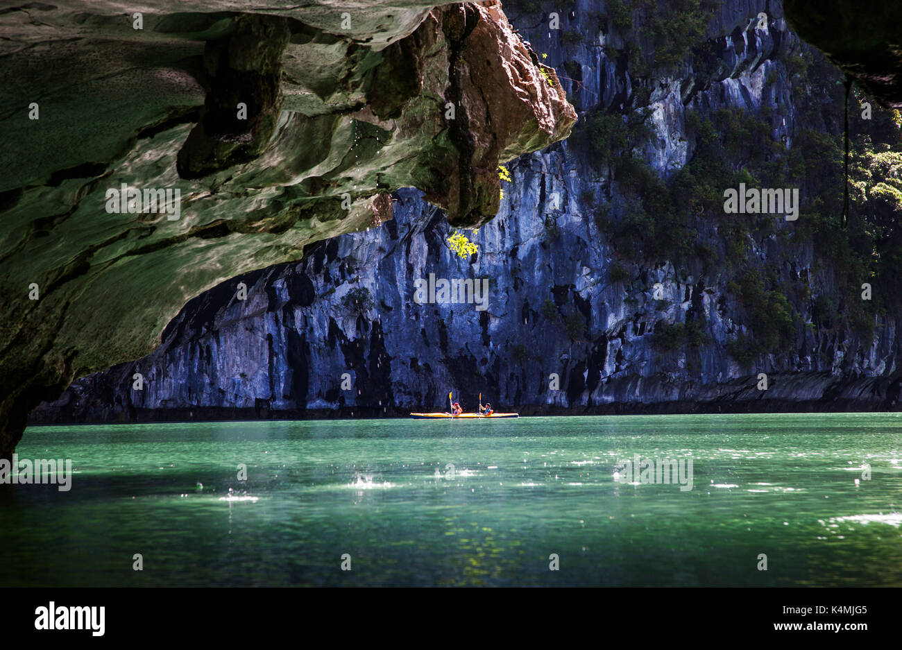 kayaking among caves and lagoon in Ha Long bay, UNESCO world heritage ...