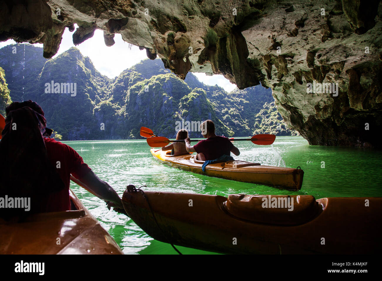 kayaking among caves and lagoon in Ha Long bay, UNESCO world heritage ...