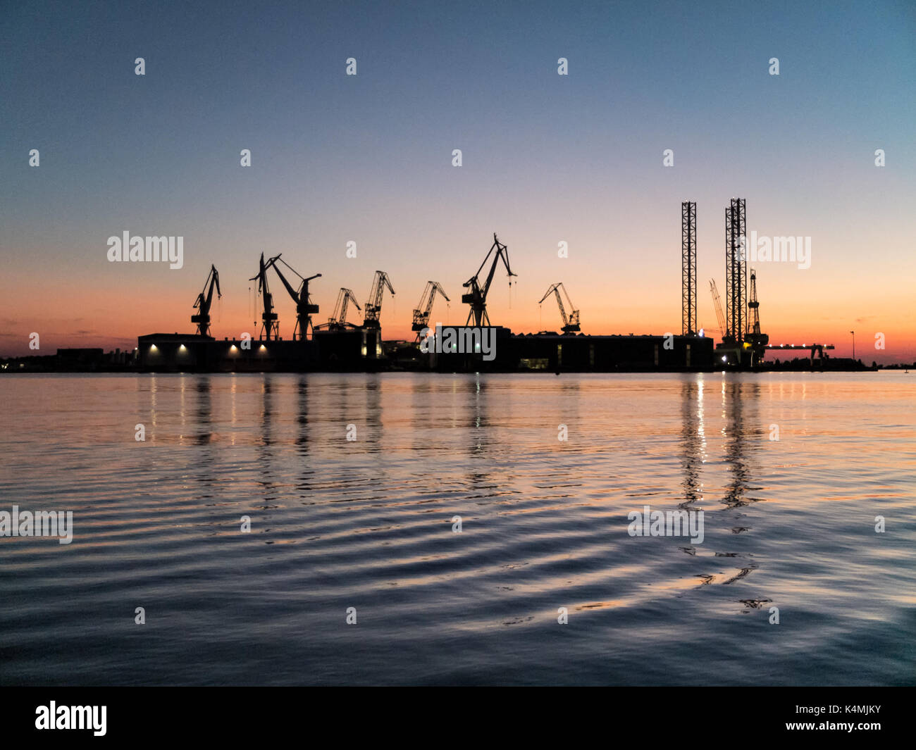 Shipyard on the sea at the sunset Stock Photo - Alamy