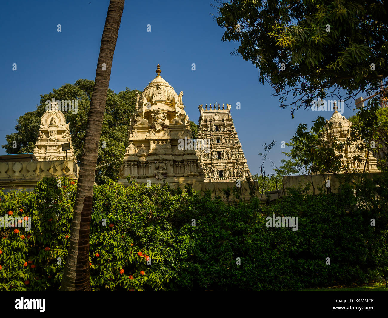Beautiful view of a hindu temple with some sculptures around the ...