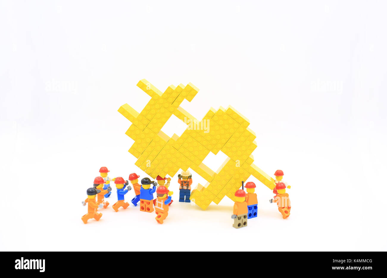 lego worker for money Stock Photo - Alamy