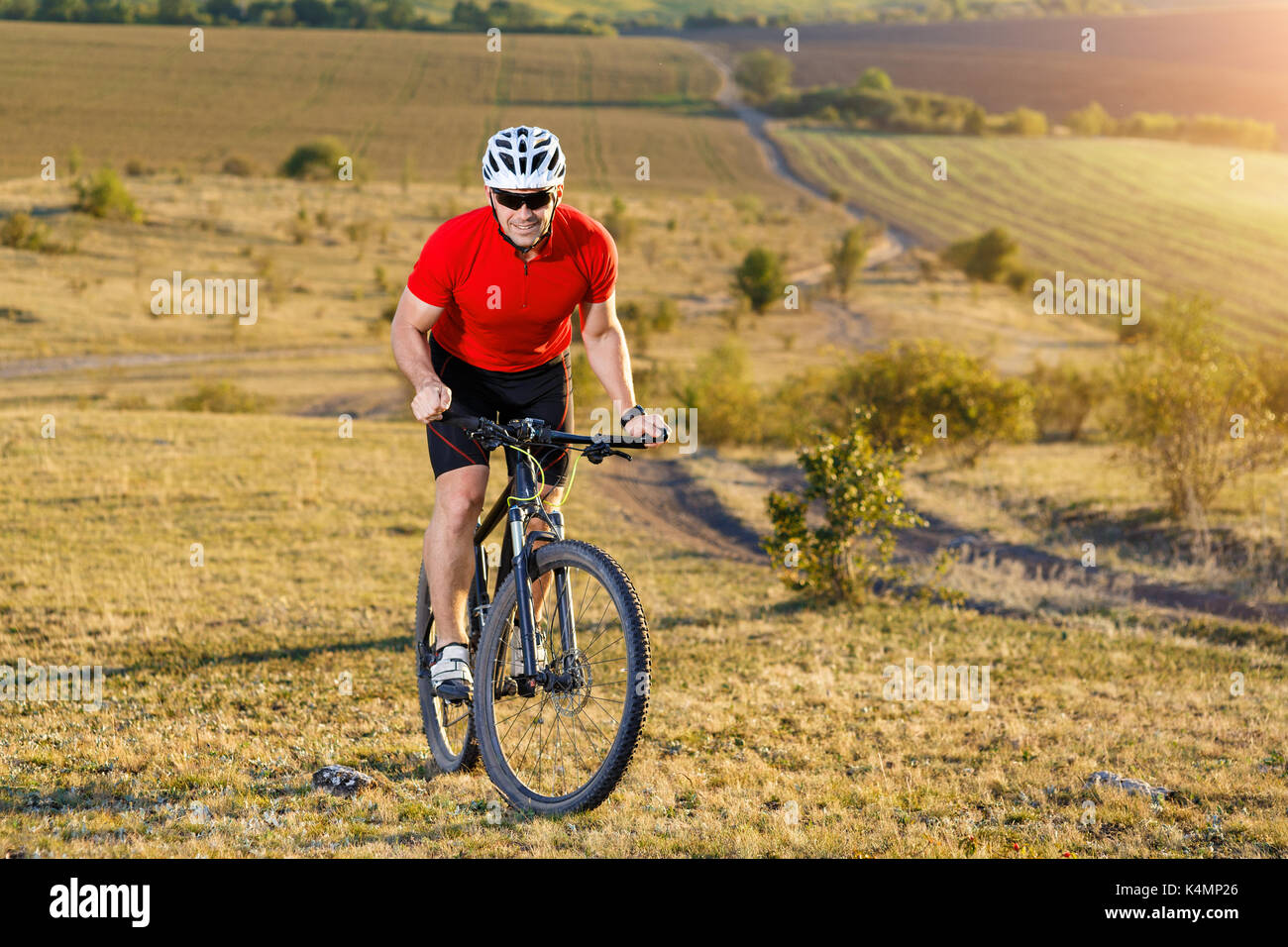 Biker tourist travel on mountain bike. Autumn landscape. Sportsman on ...