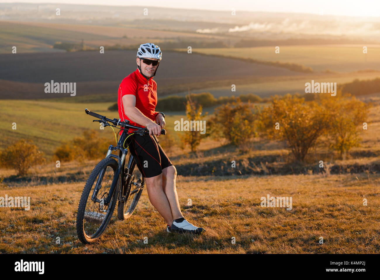 Biker tourist travel on mountain bike. Autumn landscape. Sportsman on ...