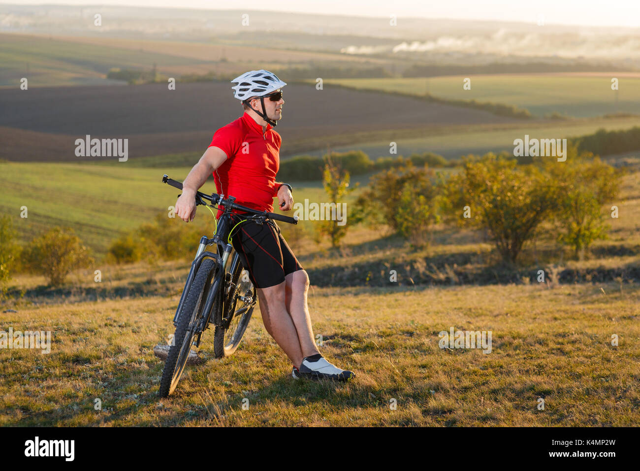 Biker tourist travel on mountain bike. Autumn landscape. Sportsman on ...