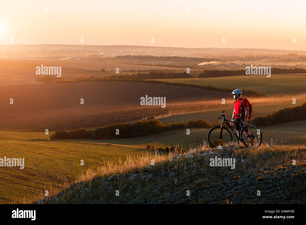 Biker tourist travel on mountain bike. Autumn landscape. Sportsman on ...