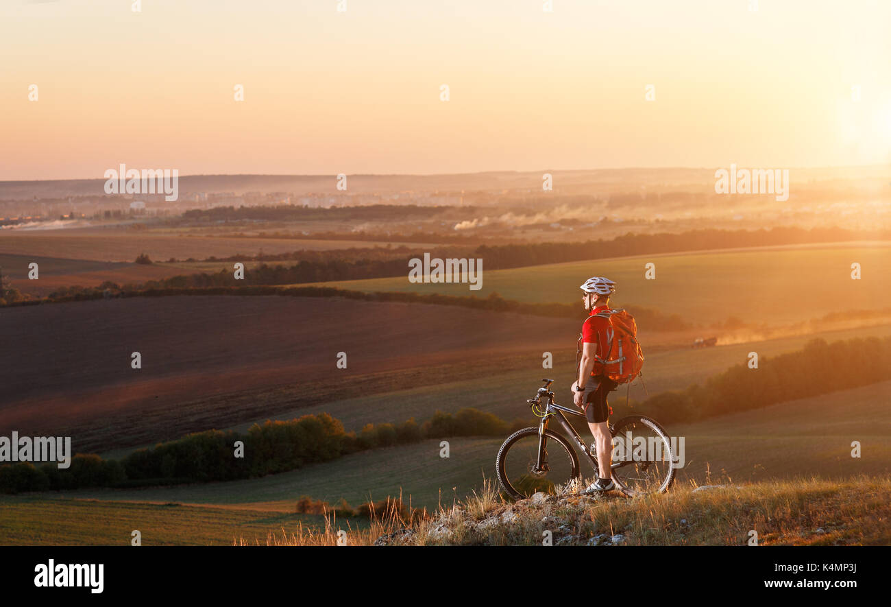 Biker tourist travel on mountain bike. Autumn landscape. Sportsman on ...