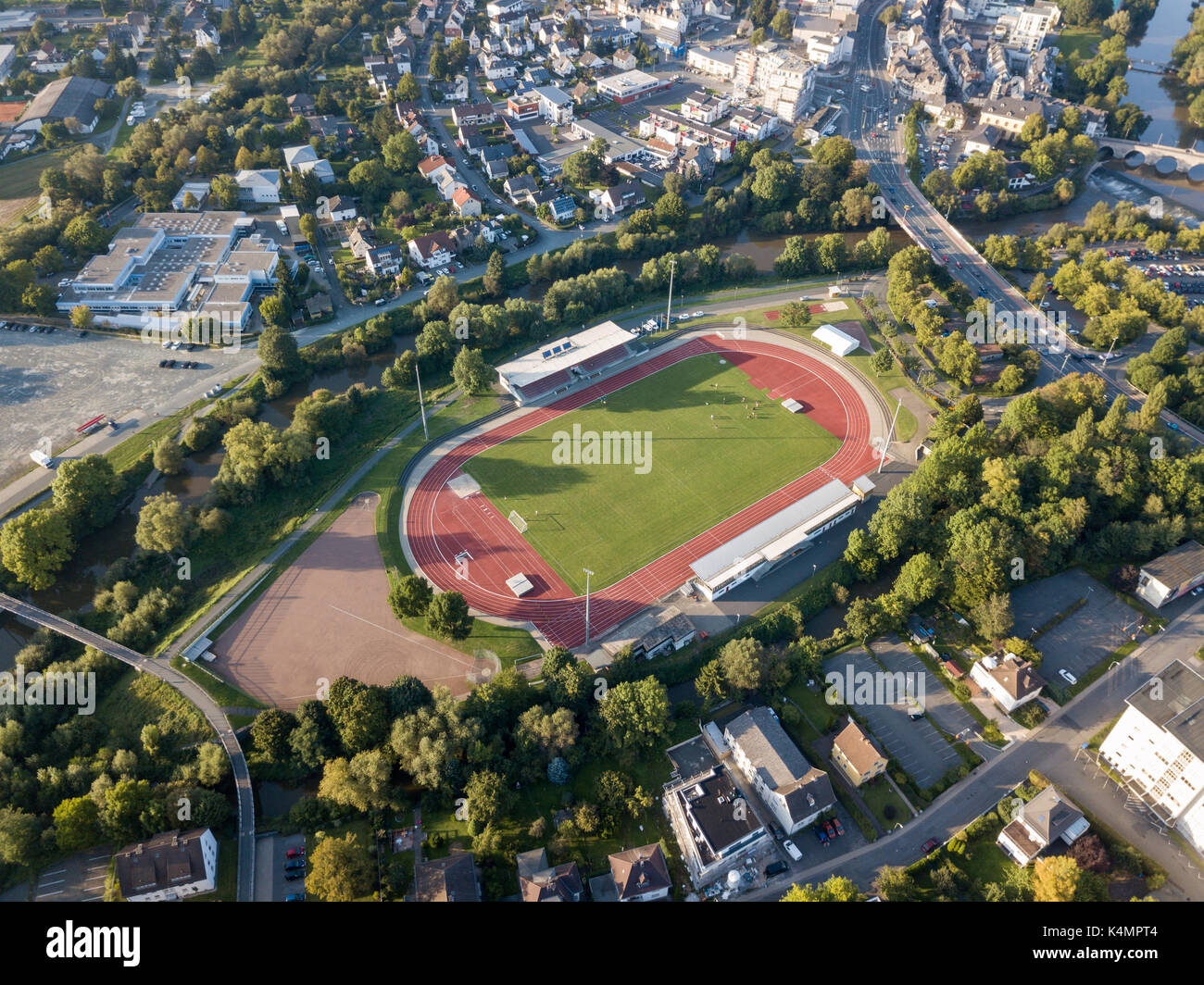 Aerial view of a soccer field in a small german town Stock Photo - Alamy