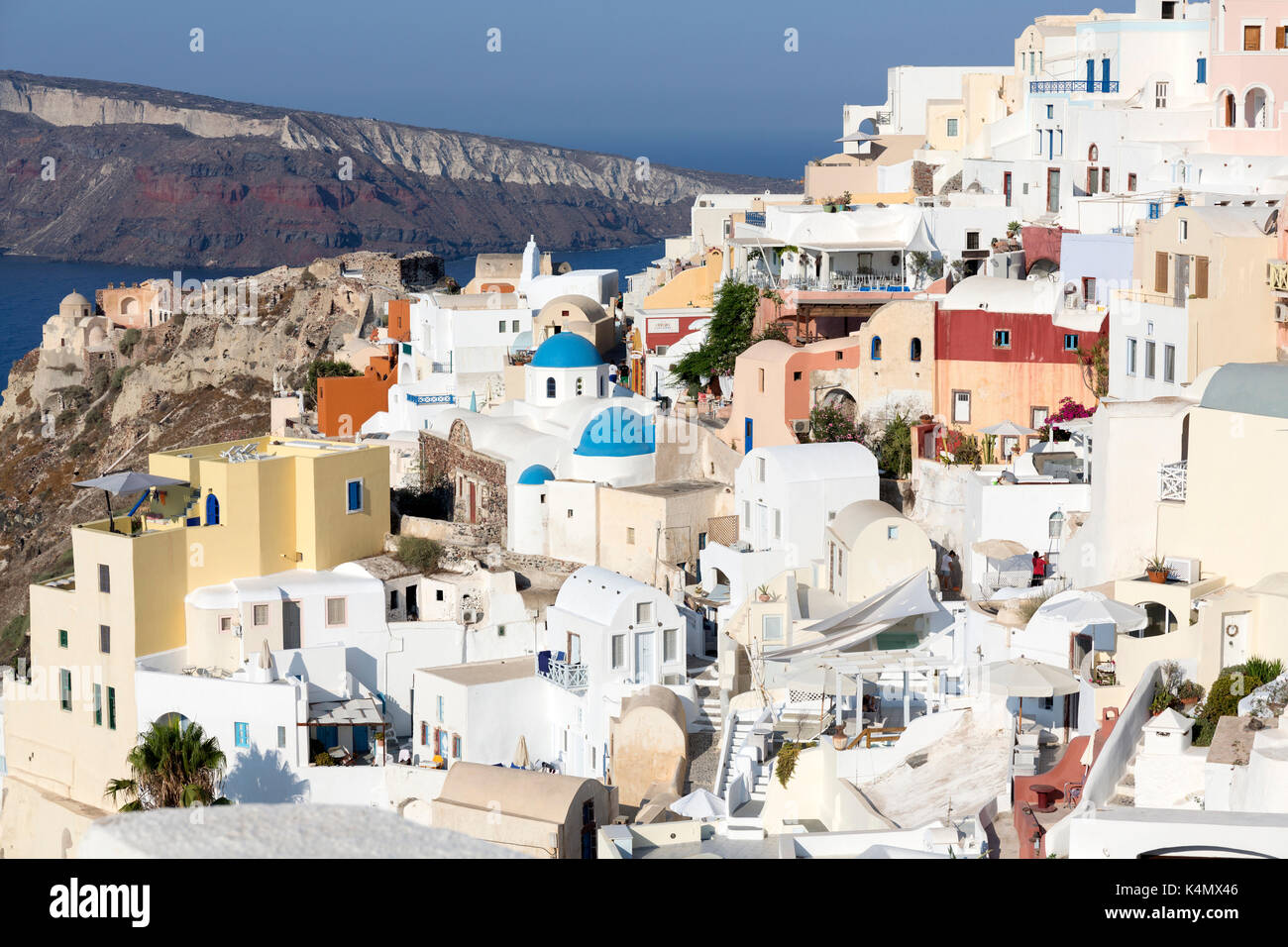 Classic view of the village of Oia with its blue domed churches and ...