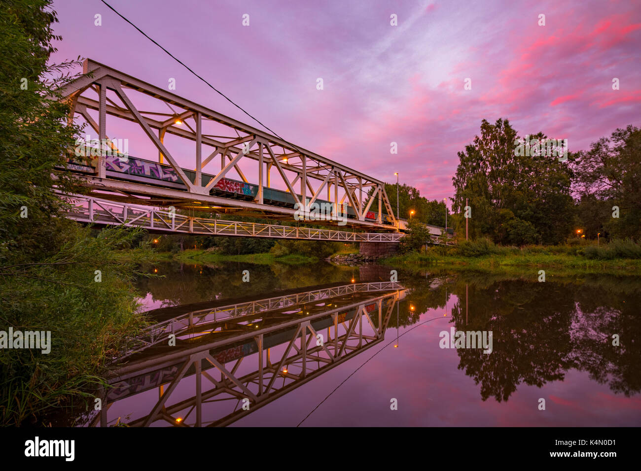 An old railway truss bridge in sunset Stock Photo - Alamy