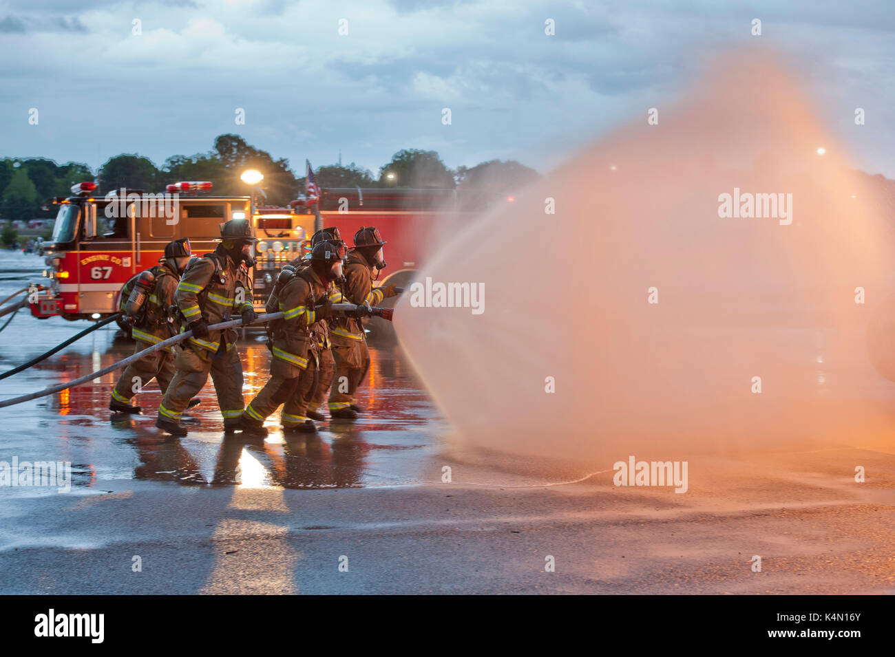 Water truck spraying water hi-res stock photography and images - Alamy