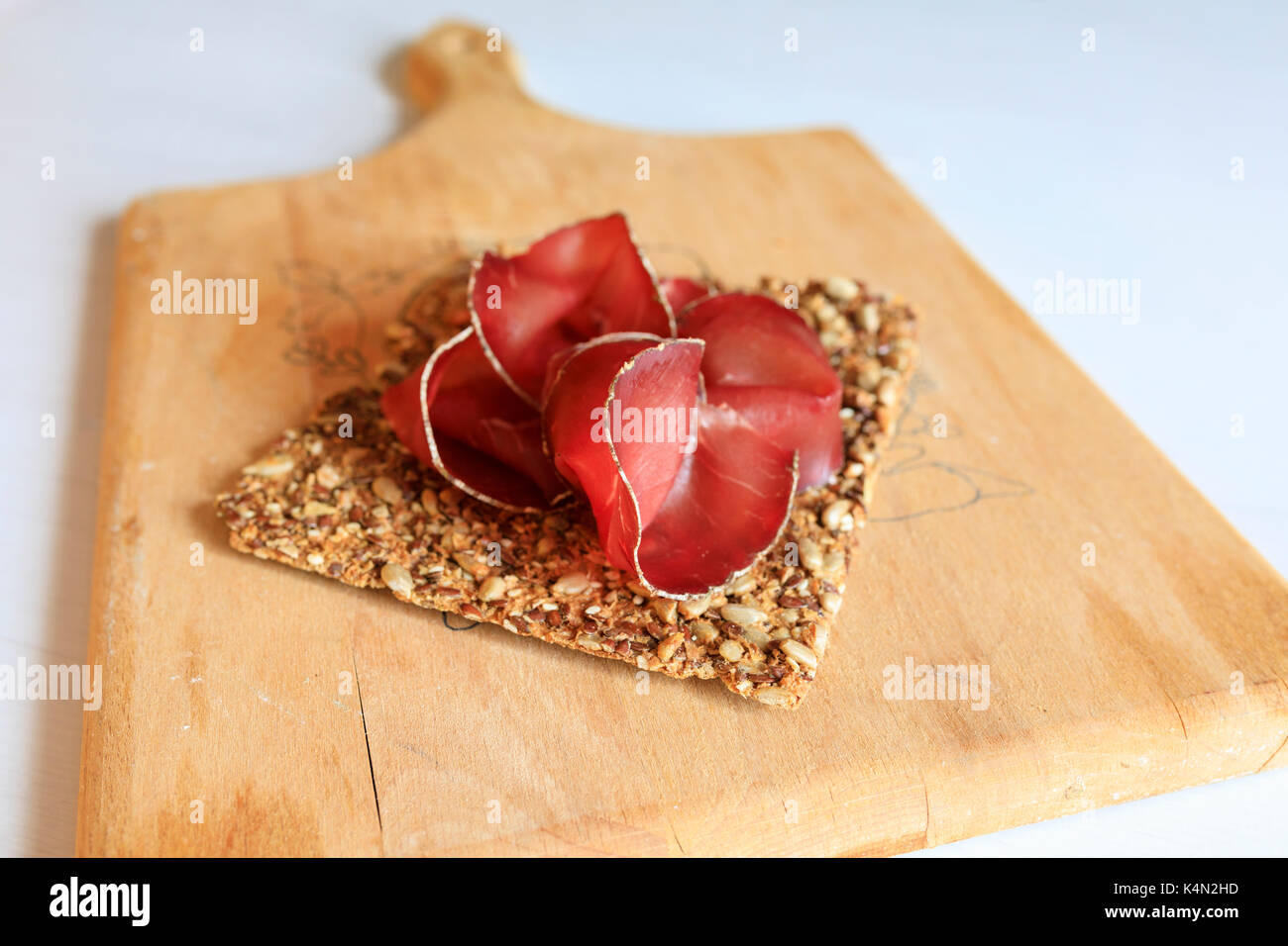 Slices of Bresaola a typical raw beef cured by salting and air-drying ...