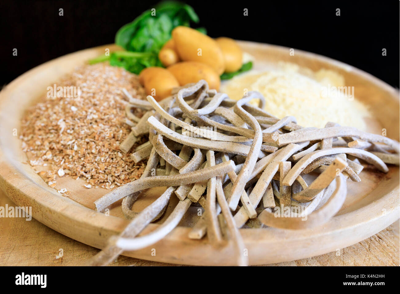 Ingredients for Pizzoccheri, a flat ribbon pasta cooked with Savoy ...