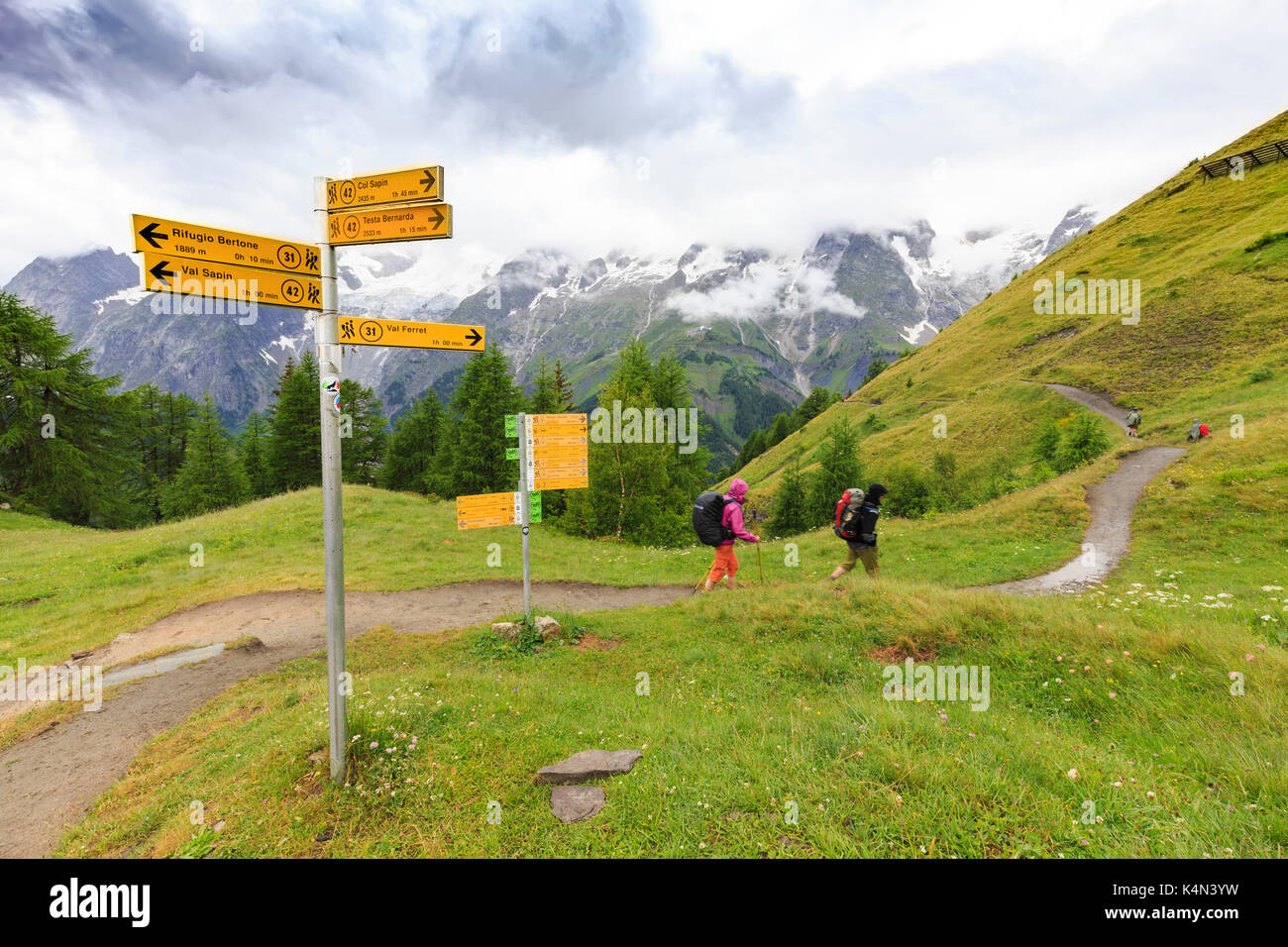 Hikers along the panoramic trail of Ferret Valley, Bertone Hut, Ferret ...