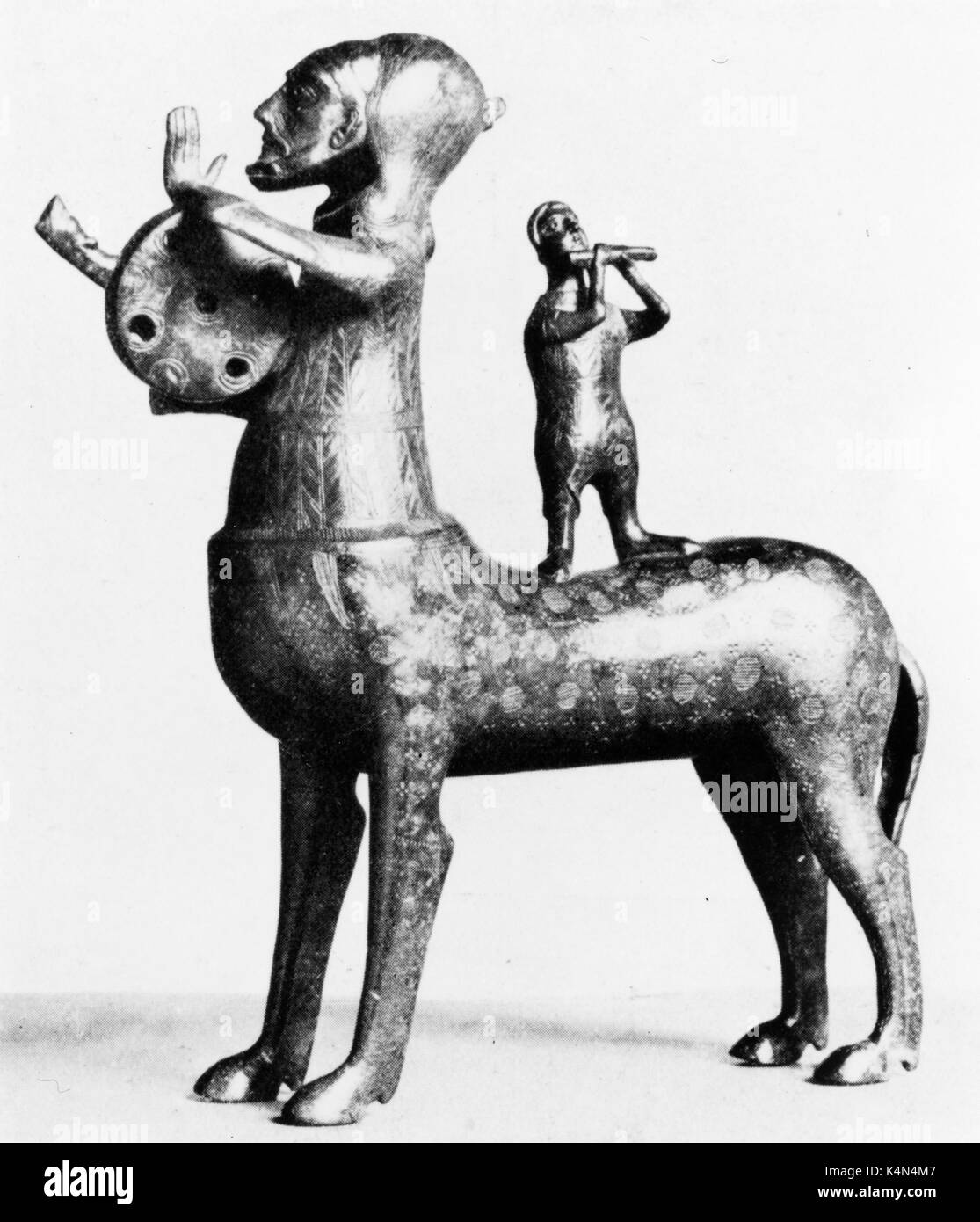 Medieval jug with two musicians (timbrel and early transverse flute ...