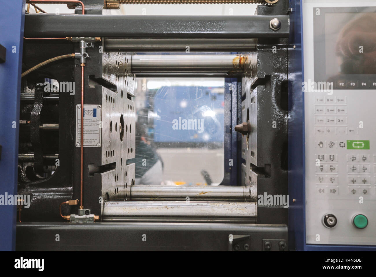 Extrusion manufacturing line - extruder, close up Stock Photo - Alamy