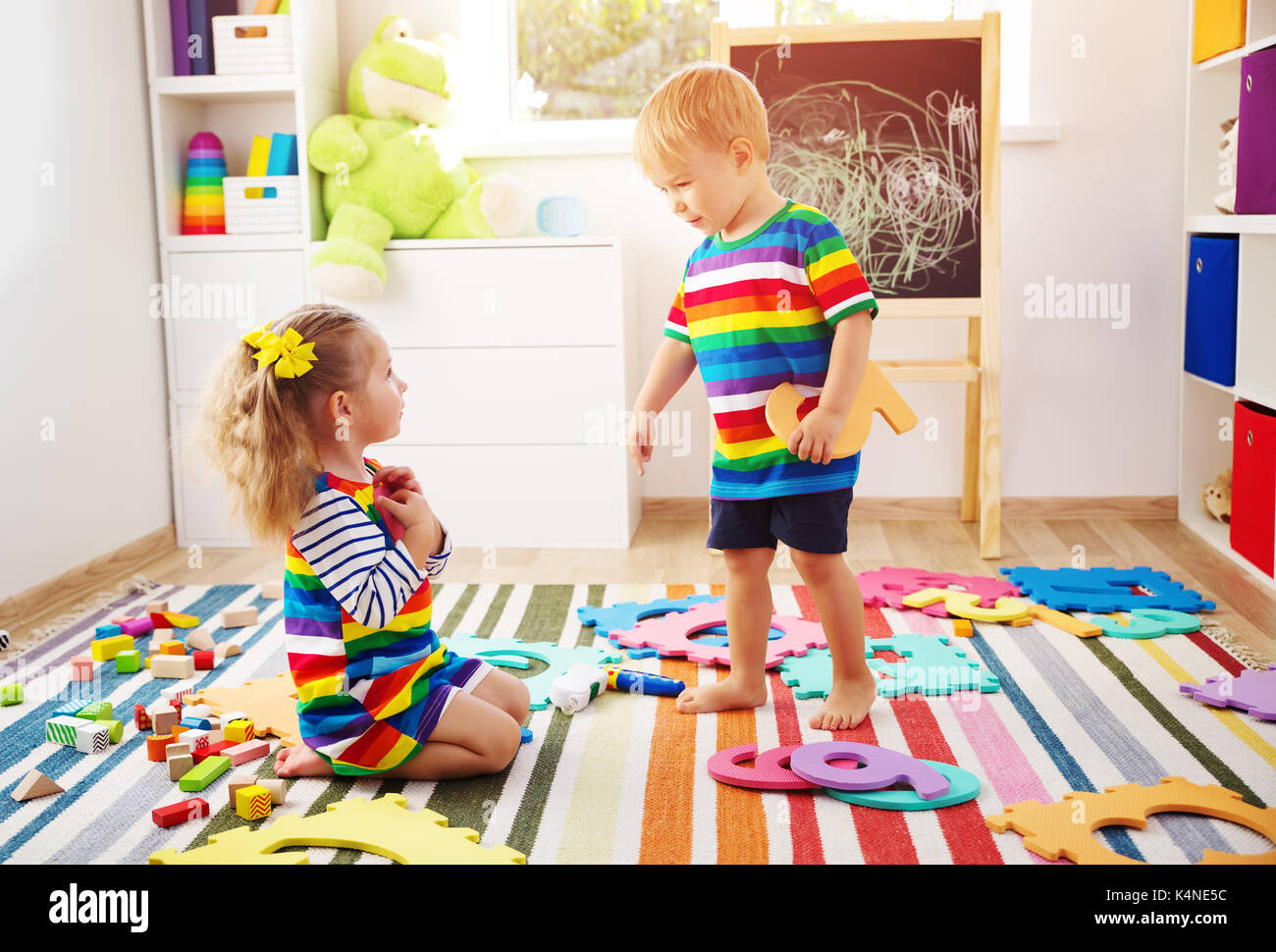 Little child playing with numbers Stock Photo - Alamy