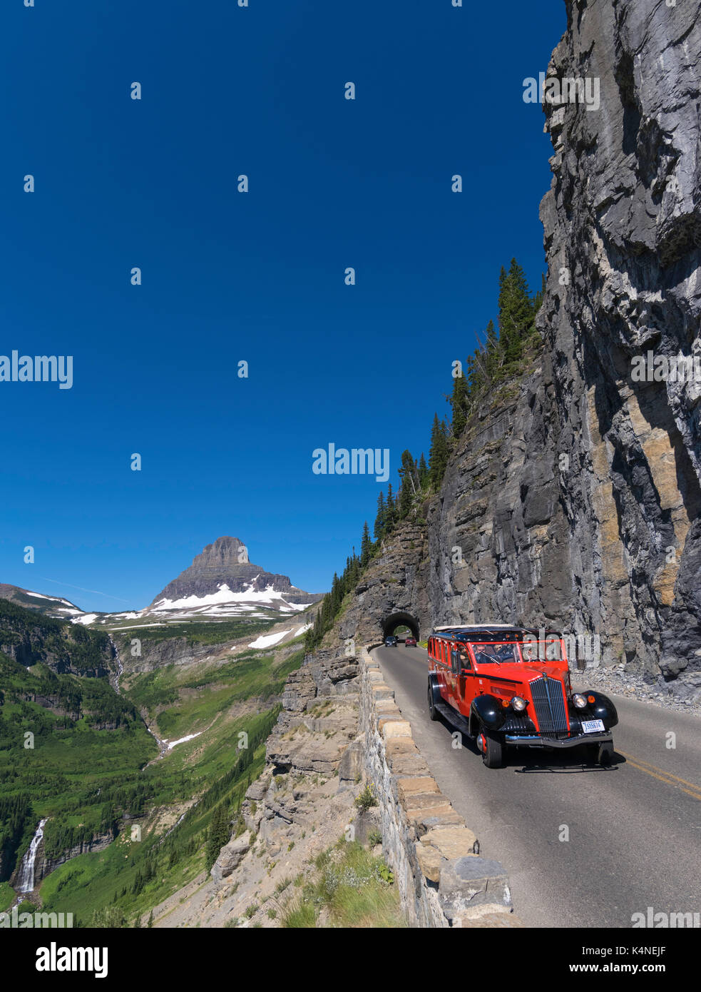 Red Jammer on Going-To-The-Sun highway, Glacier National Park, Montana ...