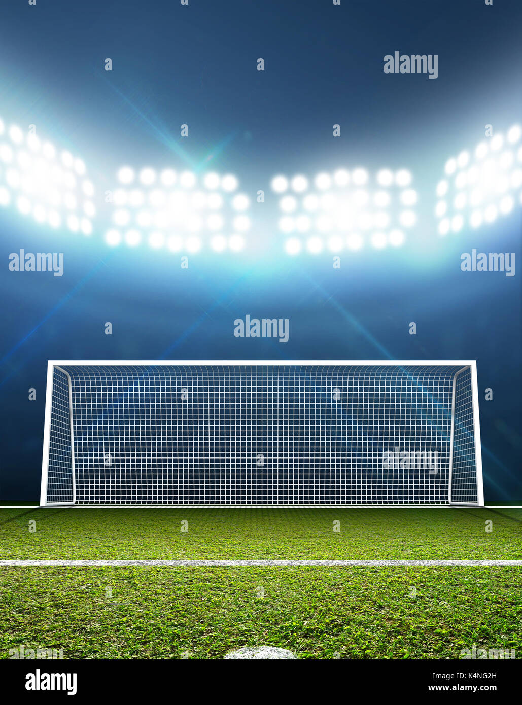 A soccer stadium with a marked green grass pitch and goal posts in the ...