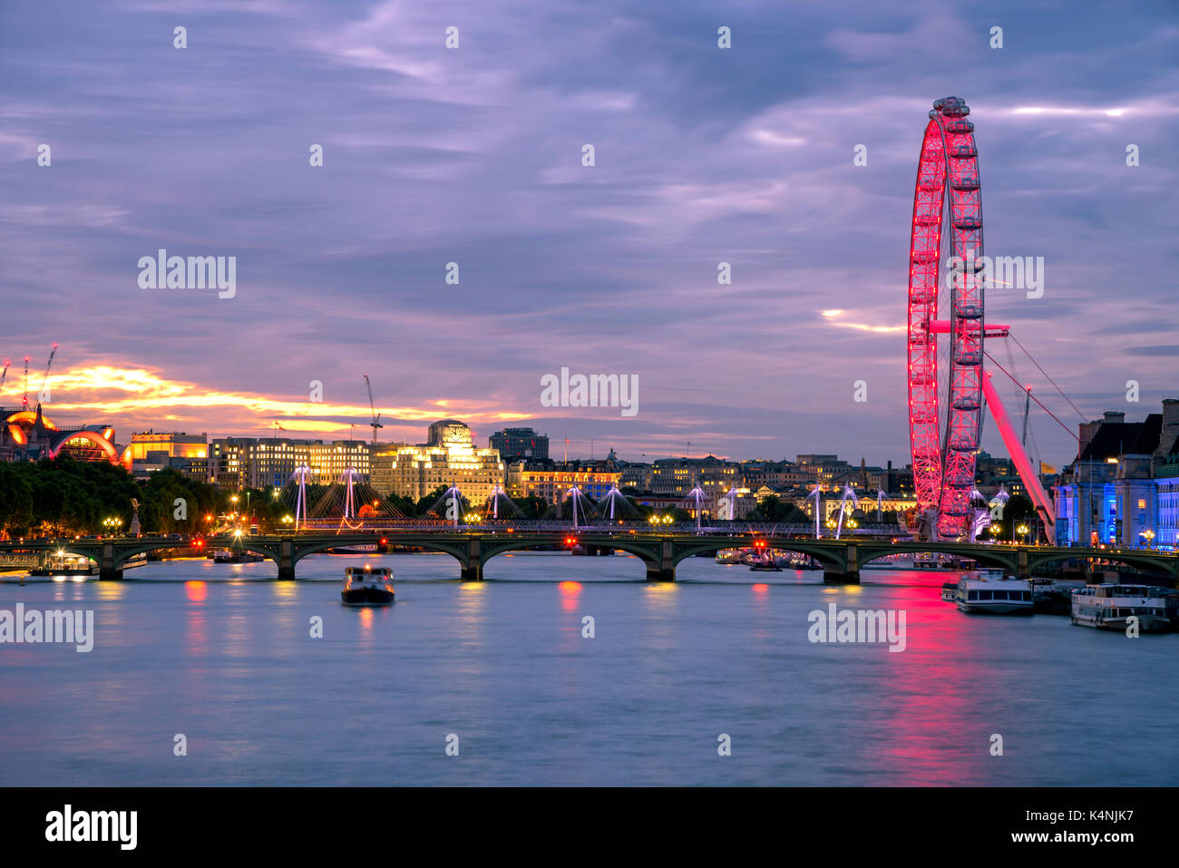 London eye illuminated in red colour over London Skyline Stock Photo ...