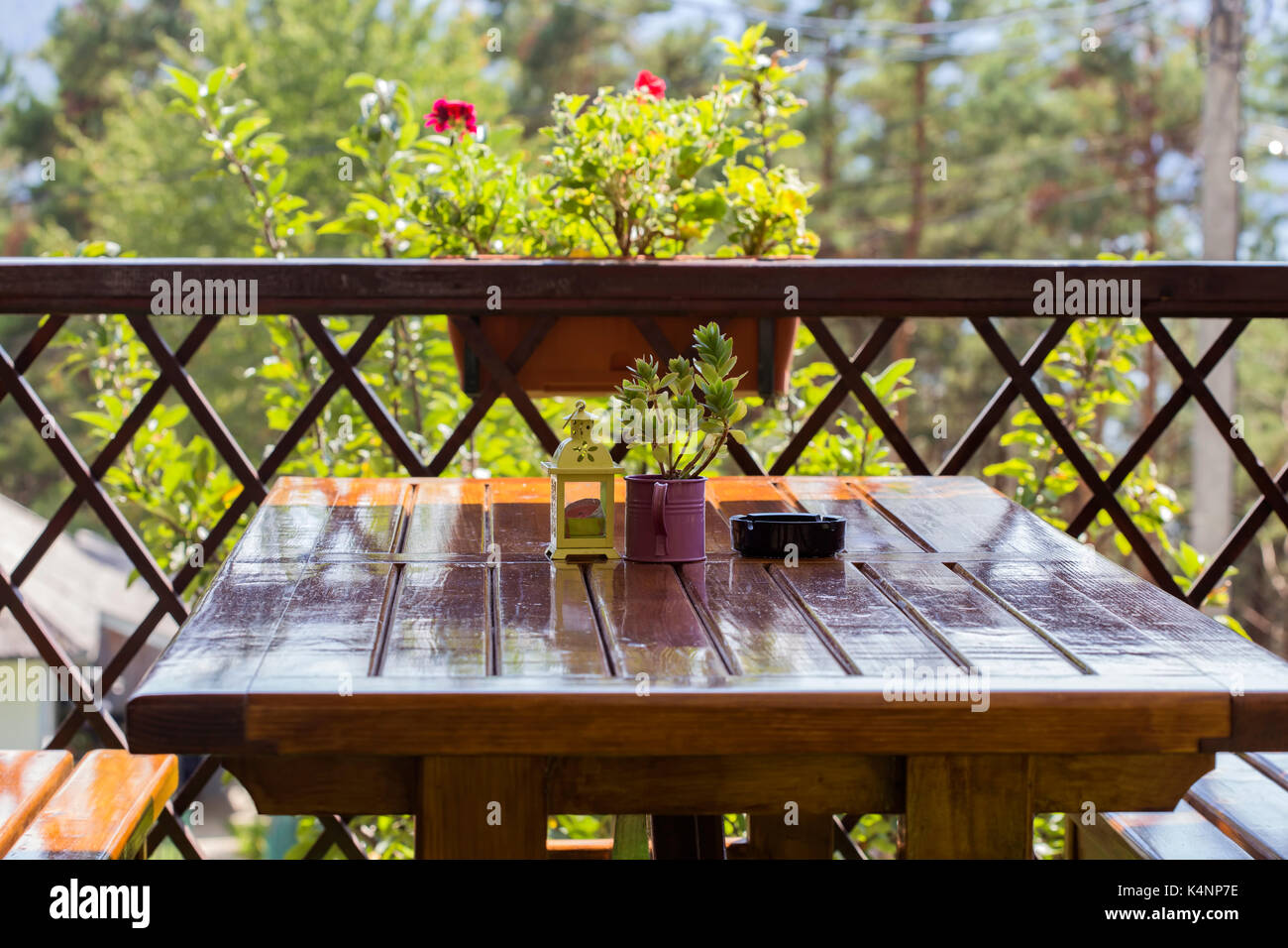Wooden table with flowers in nature Stock Photo - Alamy