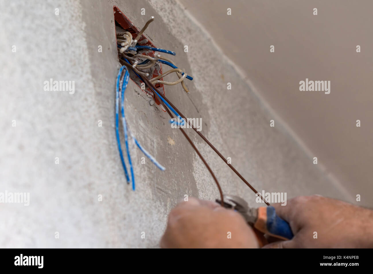 Worker fixing an old electrical installation in apartment Stock Photo ...