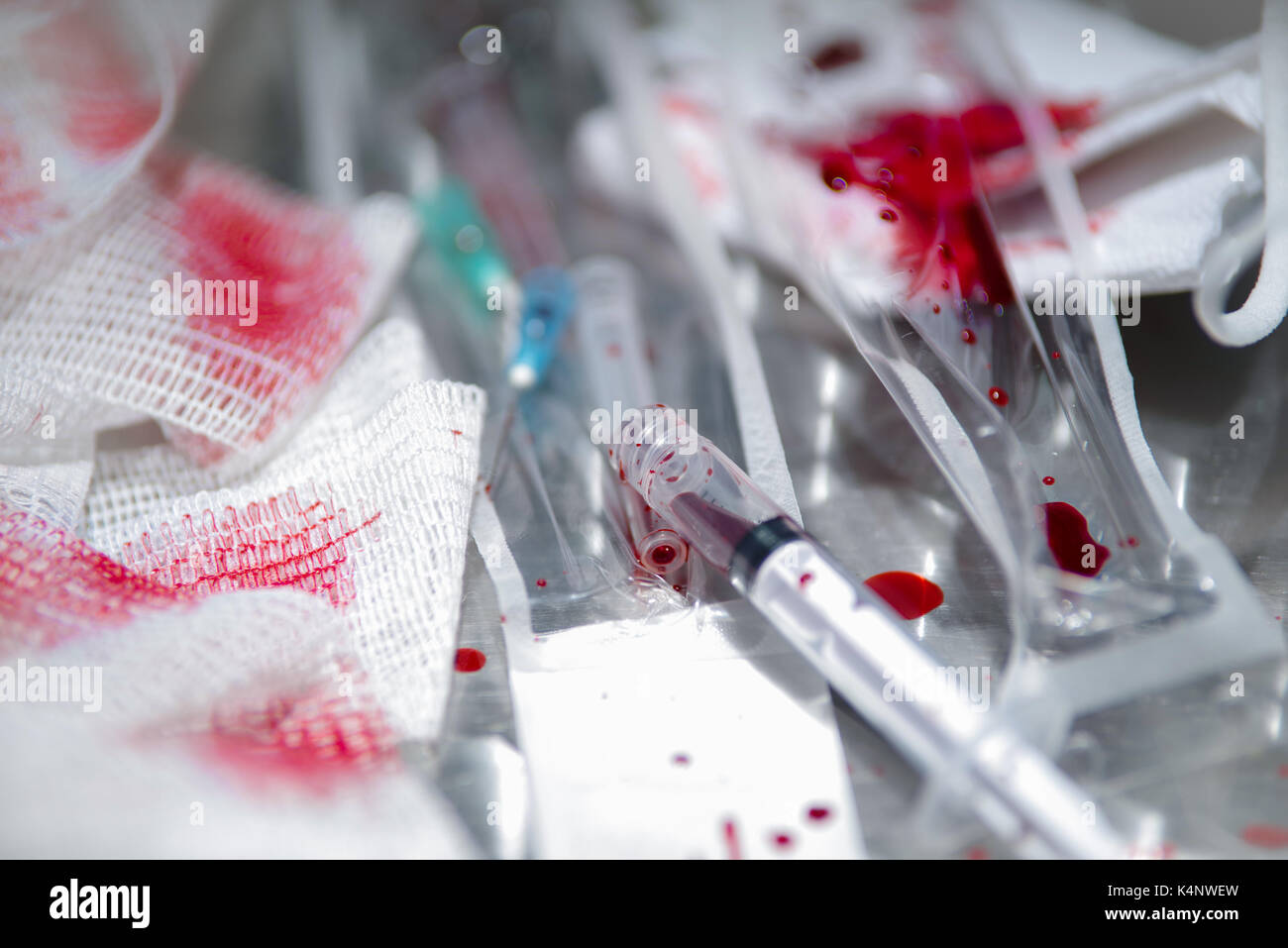 Various medical equipment after a medical intervention, with blood on ...