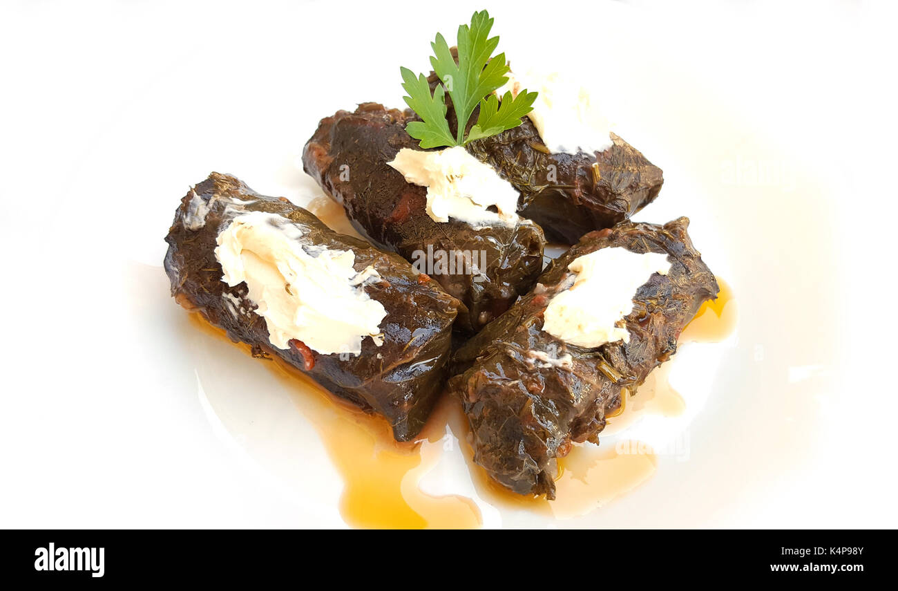 Stuffed Mediterranean vine leaves, or dolmades on white background ...
