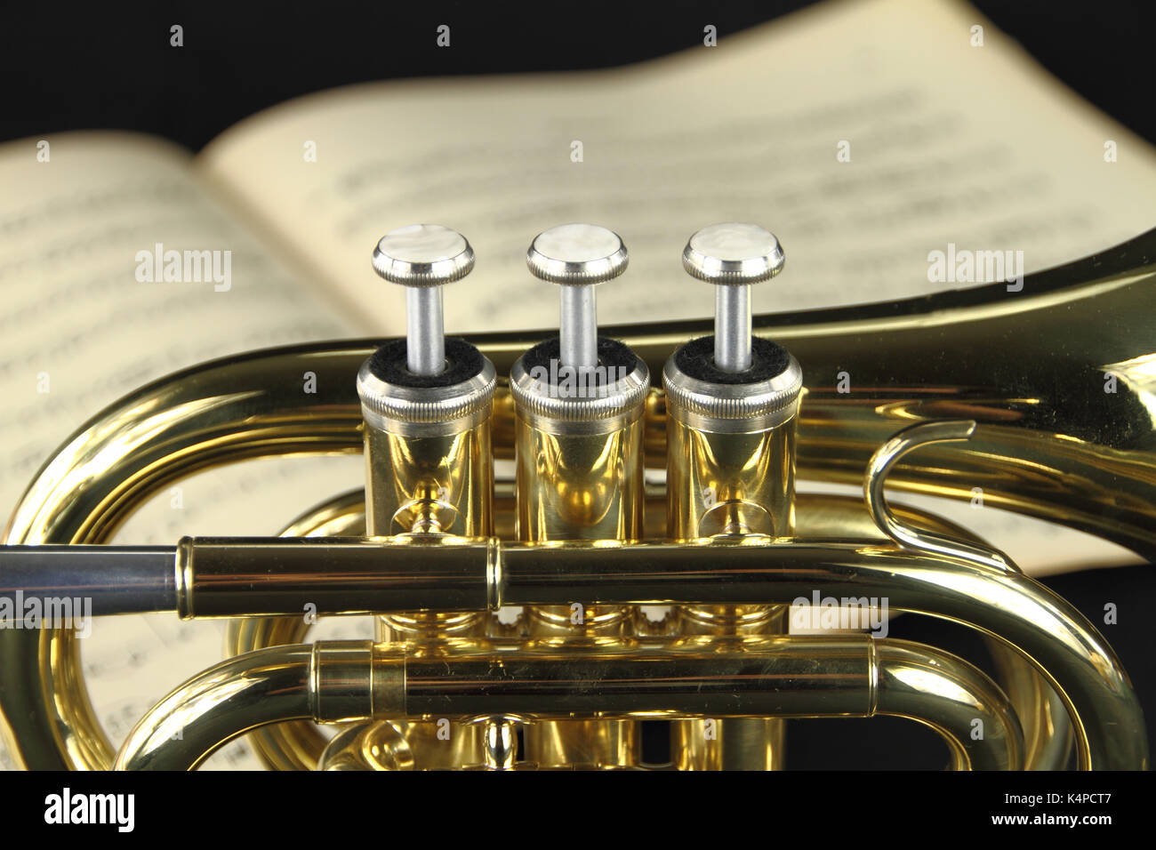 Trumpet with music sheet Stock Photo - Alamy