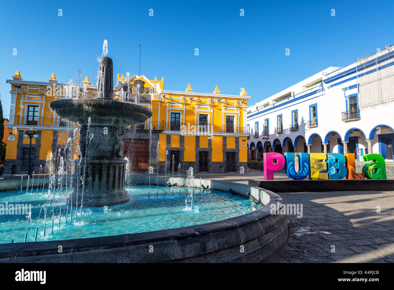 Fountain, theater, and Puebla sign in historic Puebla, Mexico Stock ...