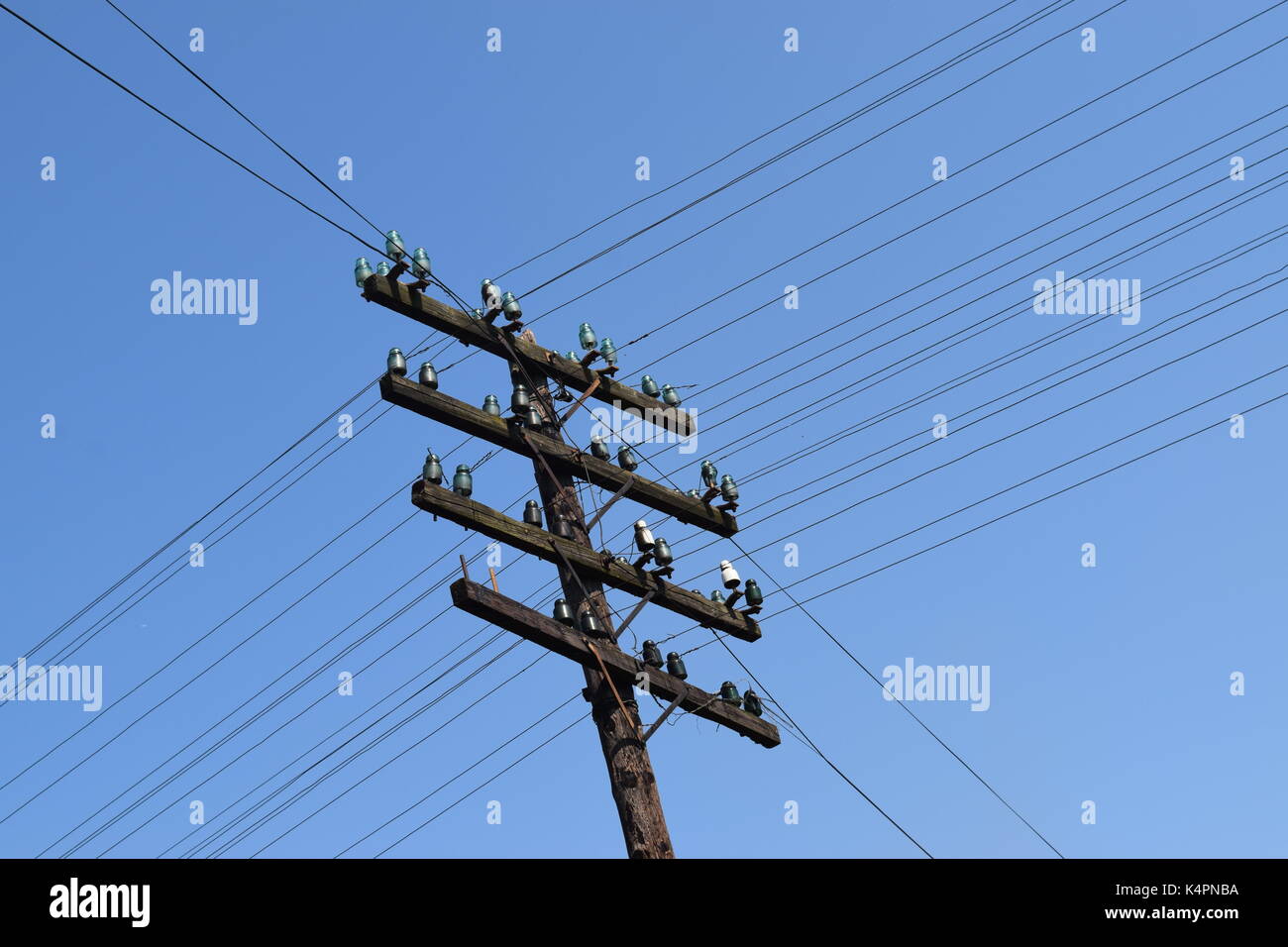 Tall electric line on a pole Stock Photo - Alamy