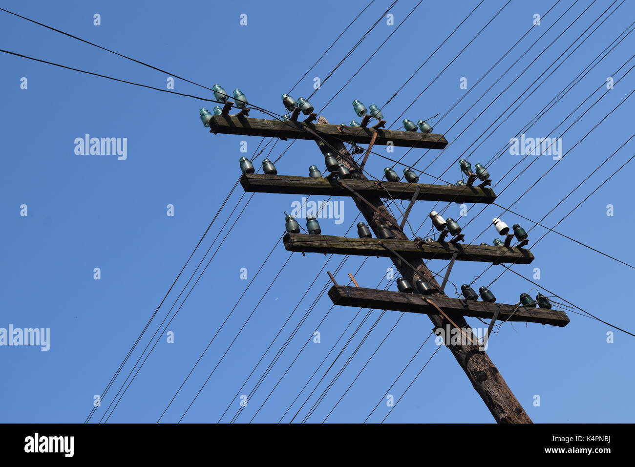 Tall electric line on a pole Stock Photo - Alamy