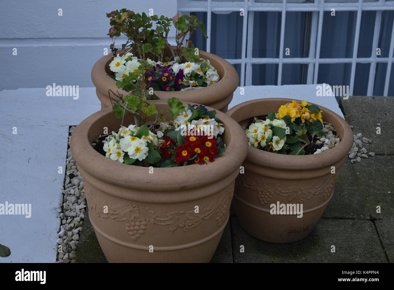 Three large plant pots on the ground Stock Photo - Alamy