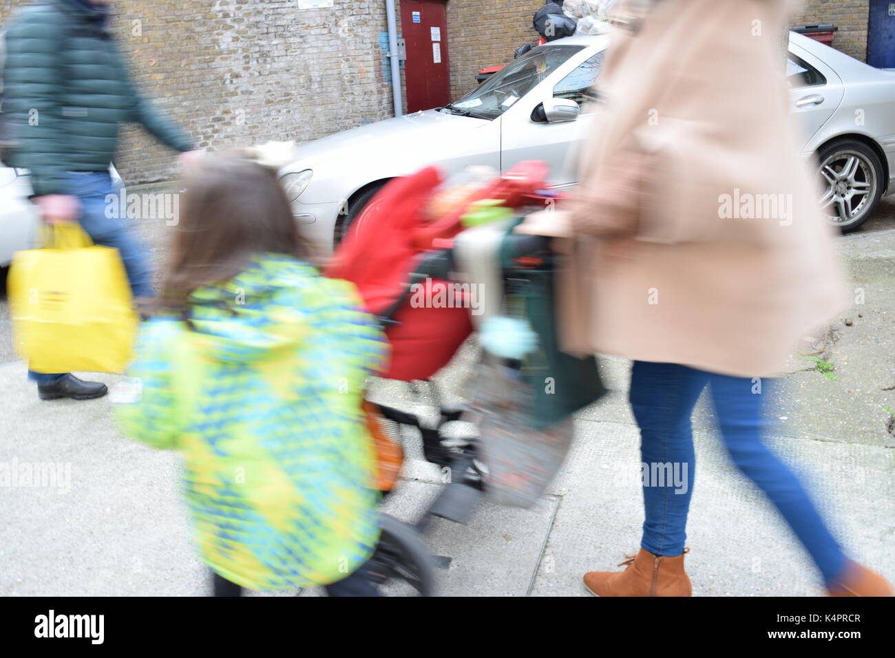 Woman pushing buggy hi-res stock photography and images - Alamy