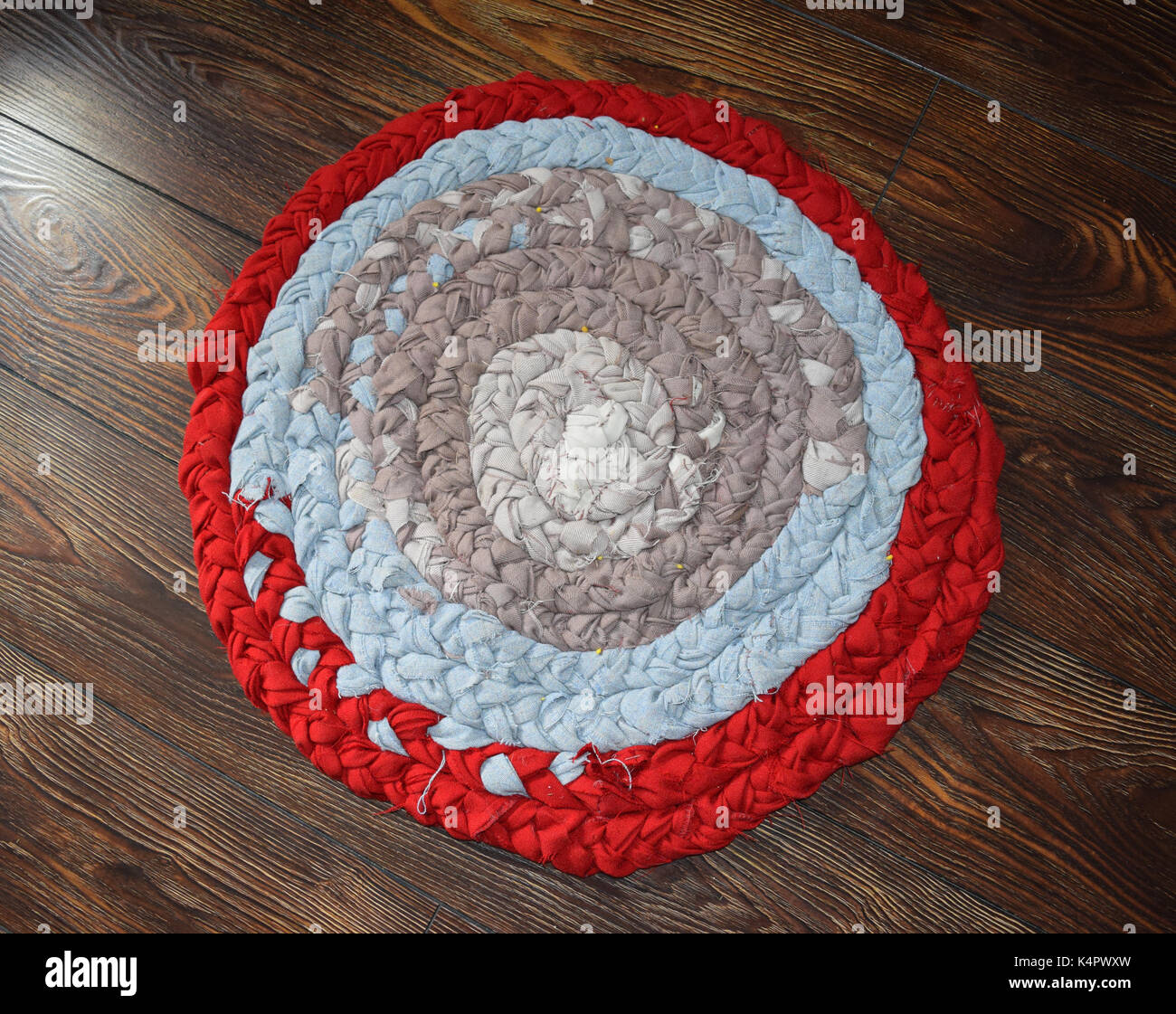 Knitted floor mat on the floor Stock Photo - Alamy