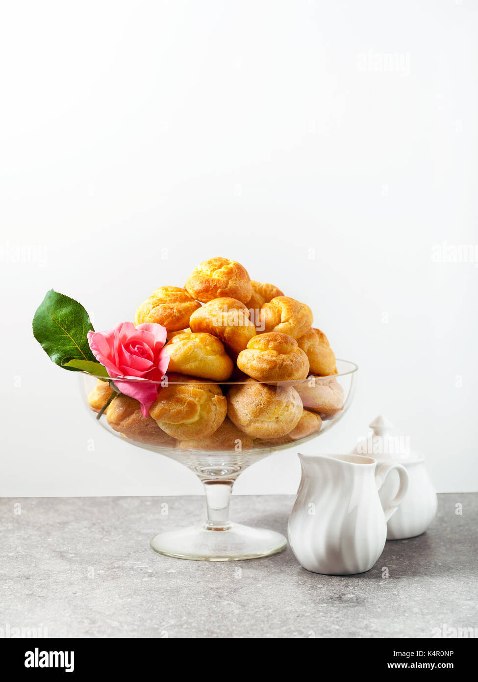 profiteroles and coffee Served in a vase for sweets and a rose Stock ...