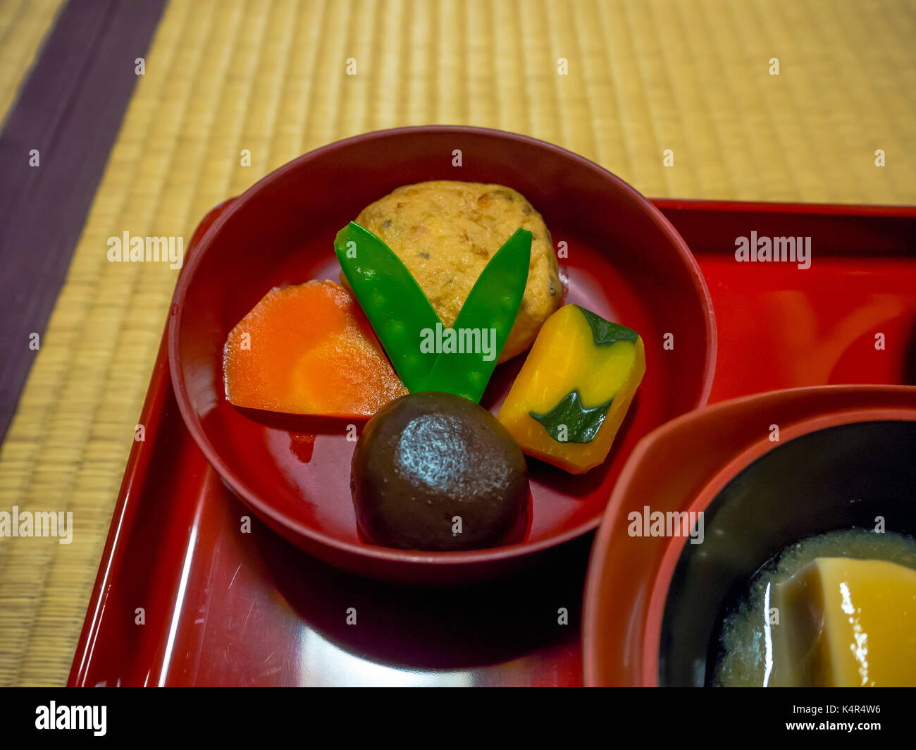 Close up of a lunch served in a red plates, in a restaurant in Japan ...