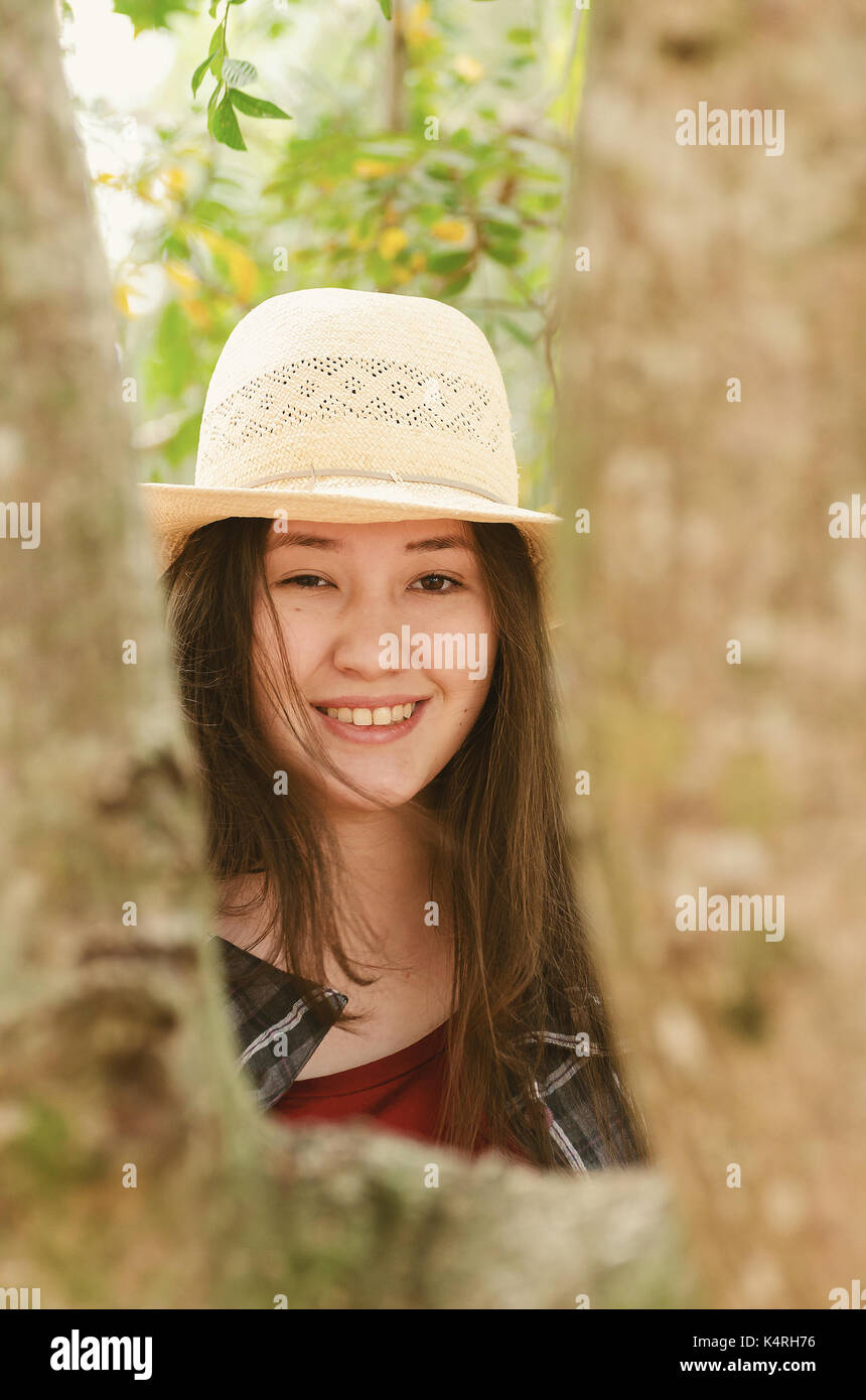 Beautiful japanese descendant woman on a nature scene. Portrait of a ...