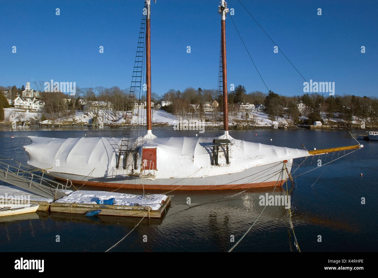 The windjammer Timberwind wainting for spring in Camden Harbor, Maine ...
