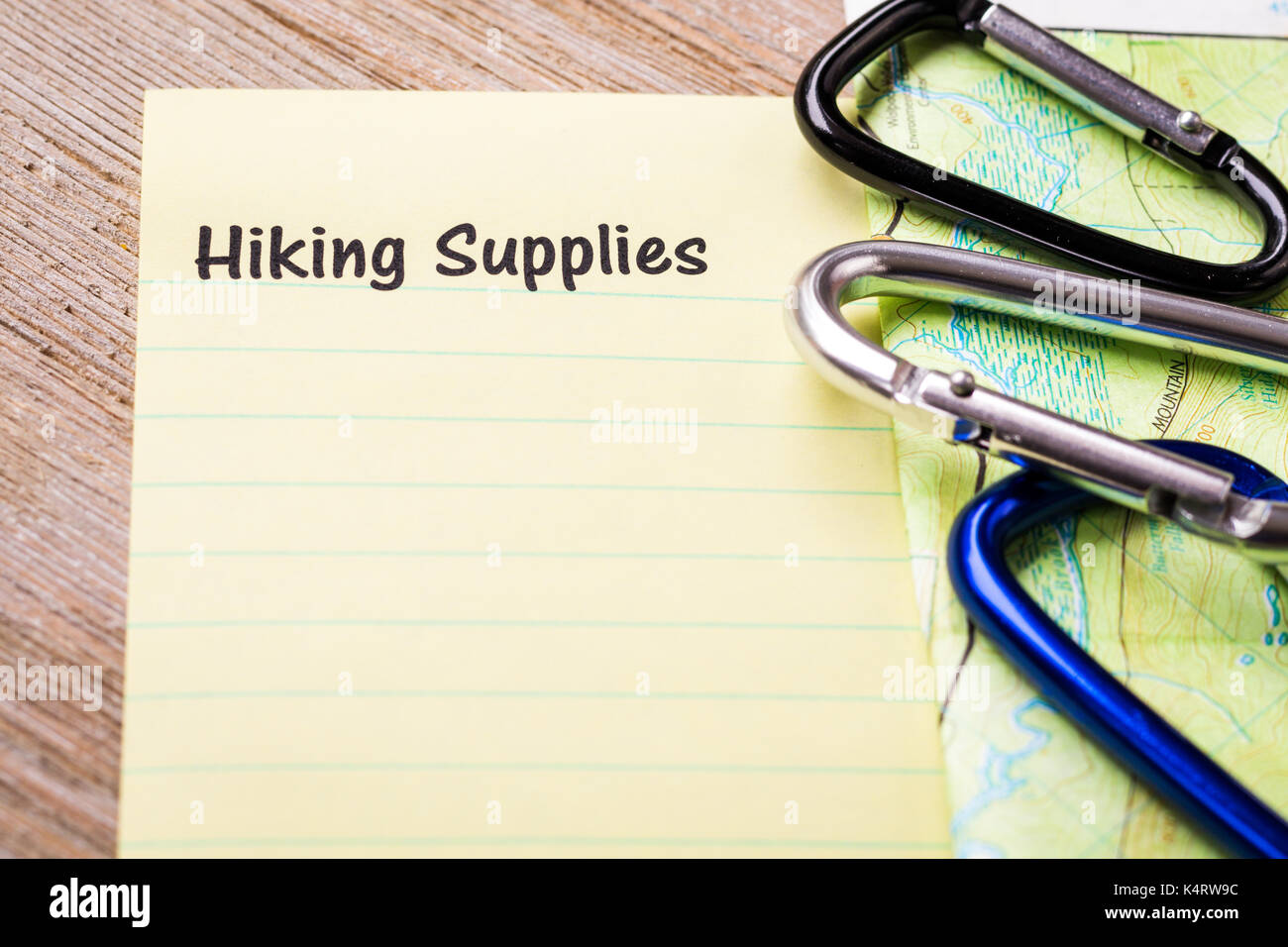 Hiking list concept on notebook and wooden board with fall accessories ...