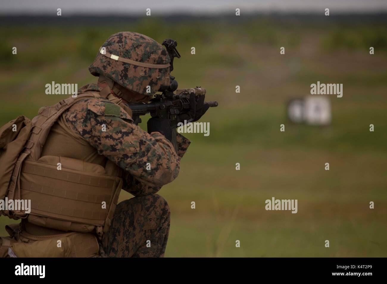 Marines fire at targets during a combat marksmanship program at Camp ...