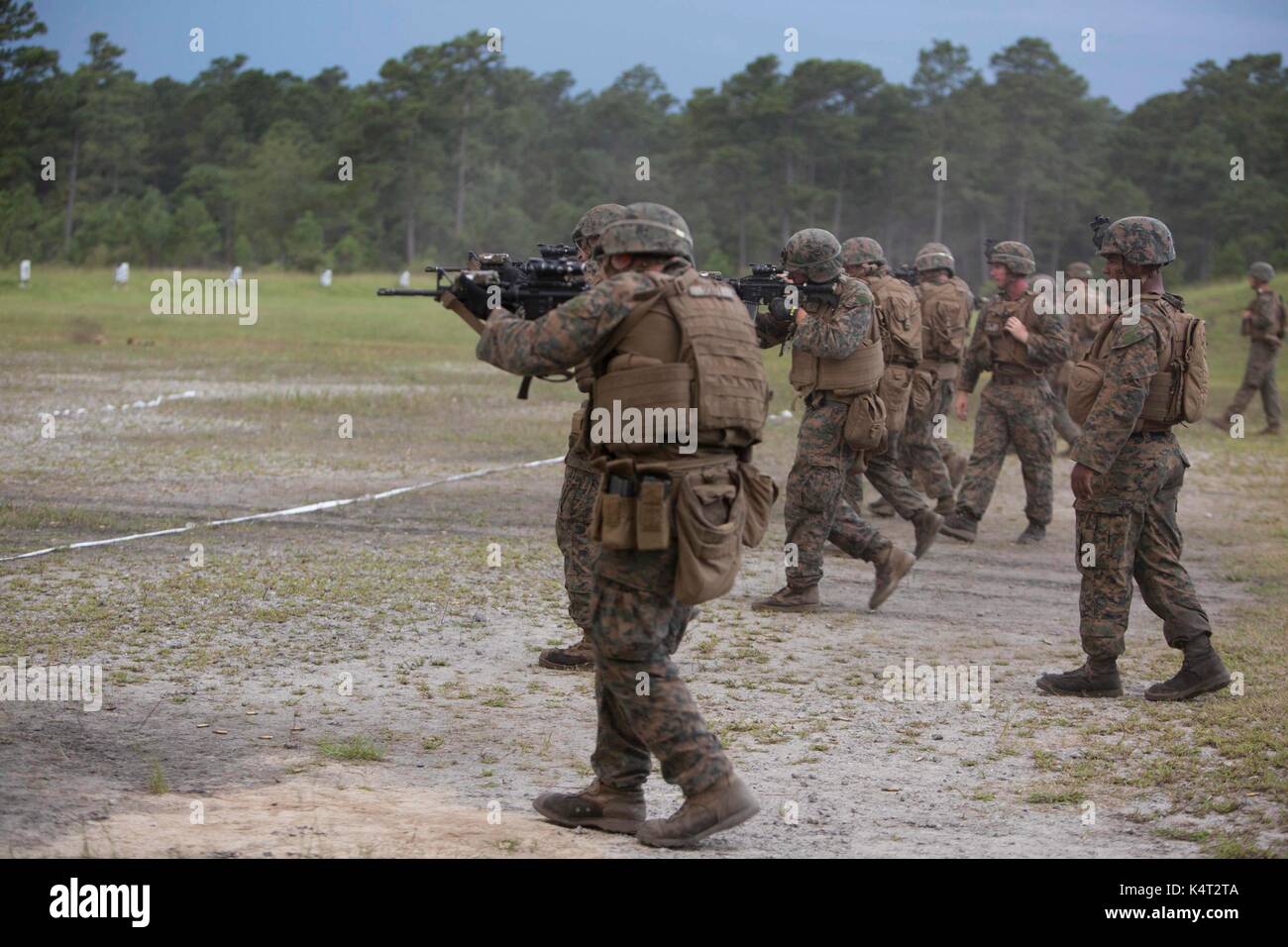 Marines fire at targets during a combat marksmanship program at Camp ...