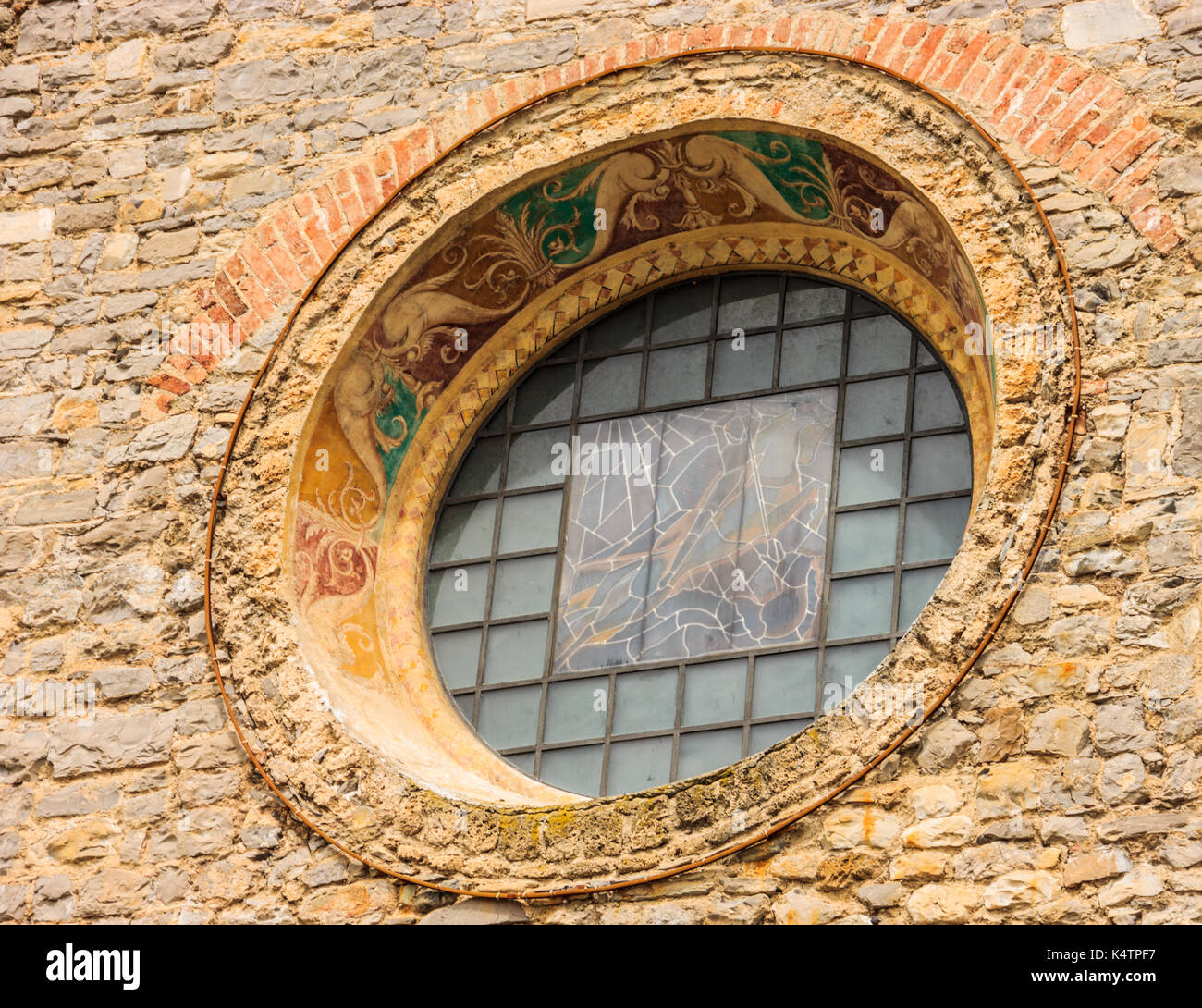 A Glass-covered 14th century fresco and rose window of the Charming ...